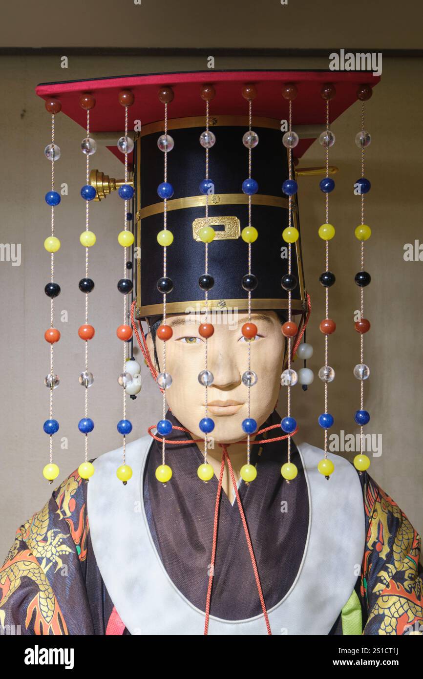 A mannequin, figure of the royal family wearing an example of ...