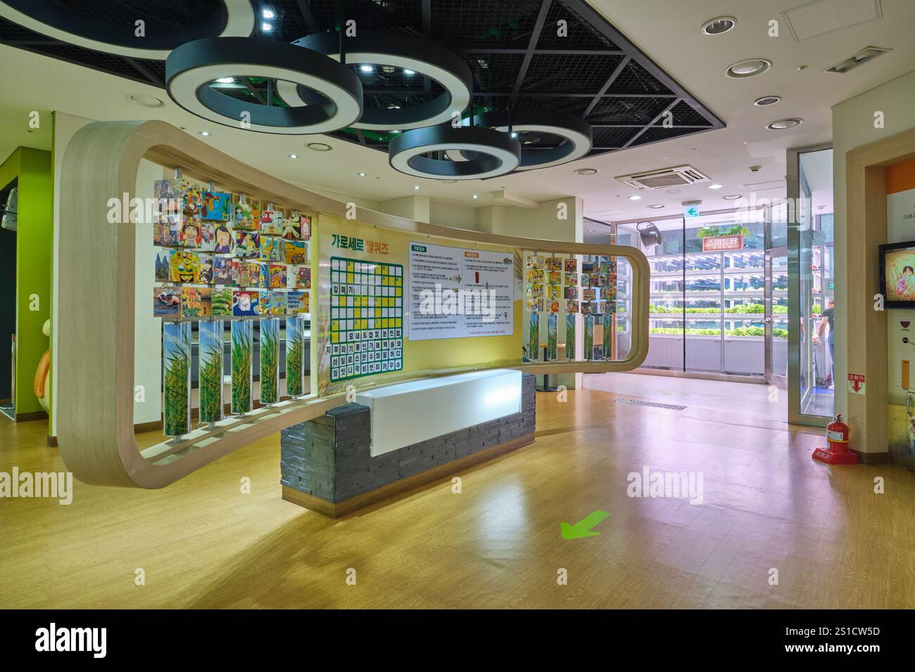 A display, education panel for kids, children with artwork, plants. At ...