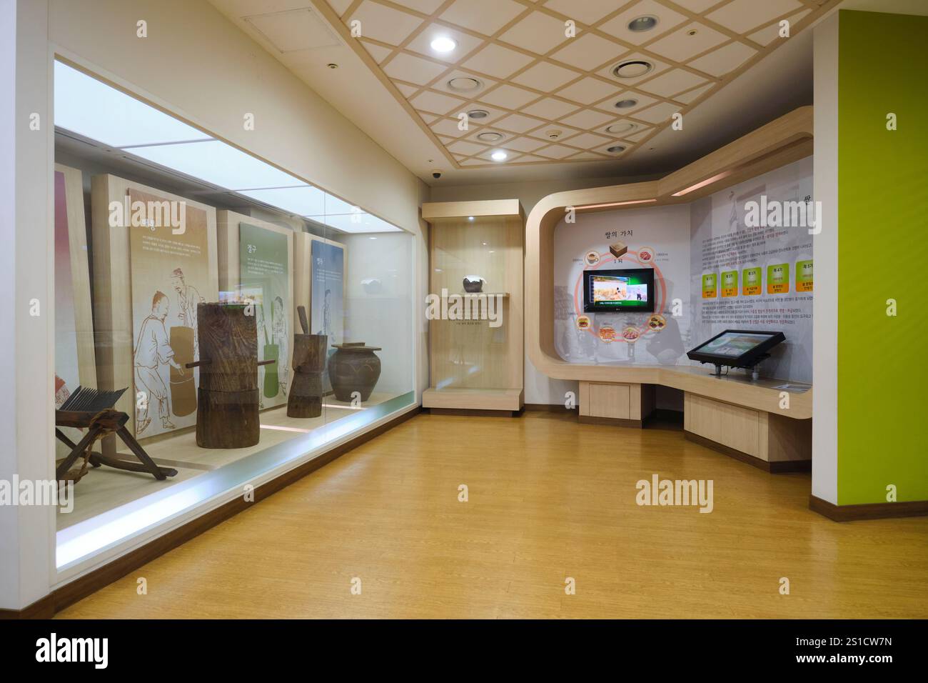 A display of old, wood processing tools and an interactive display. At ...