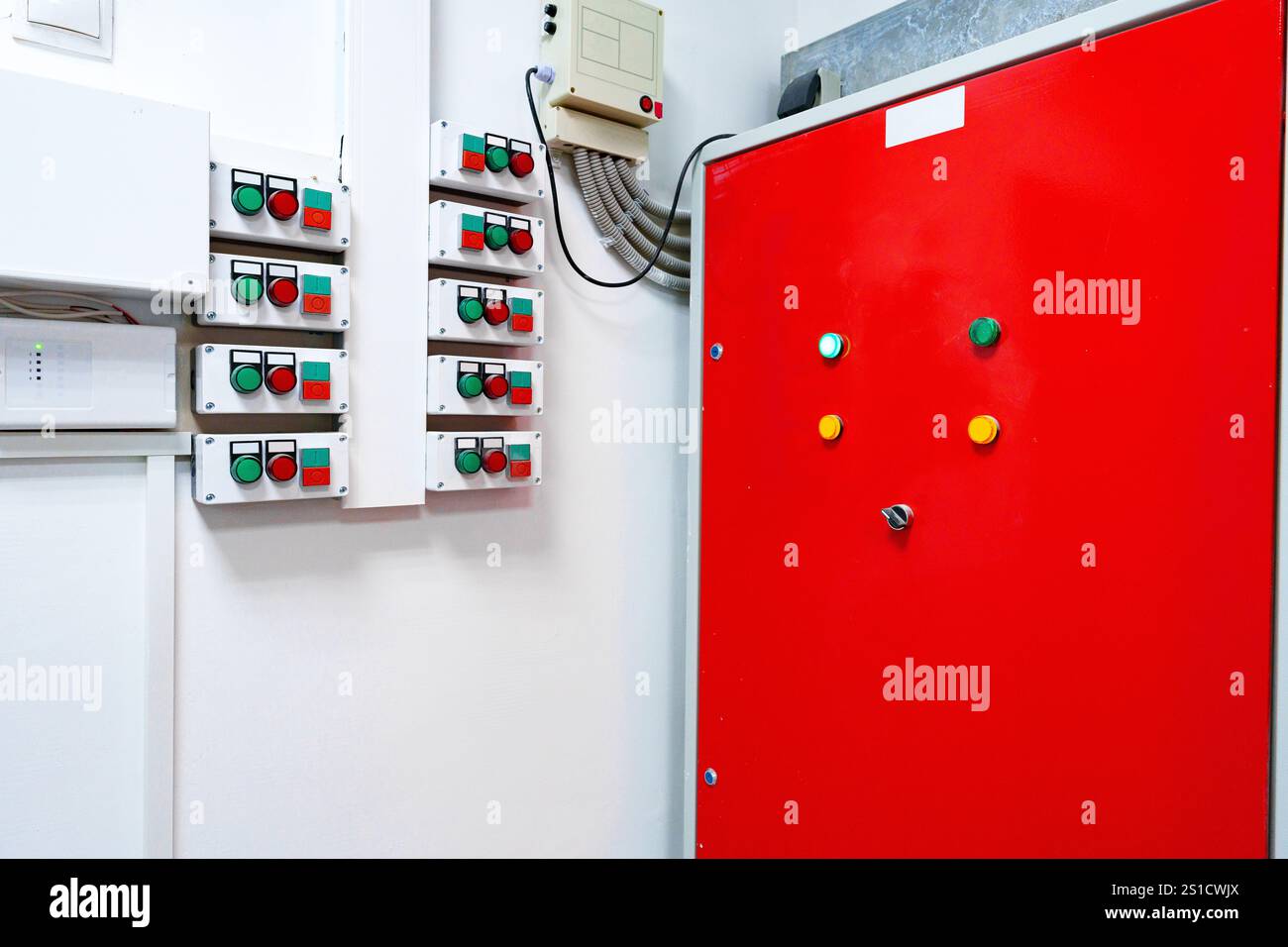 Control panel with various switches and indicators in a utility room ...