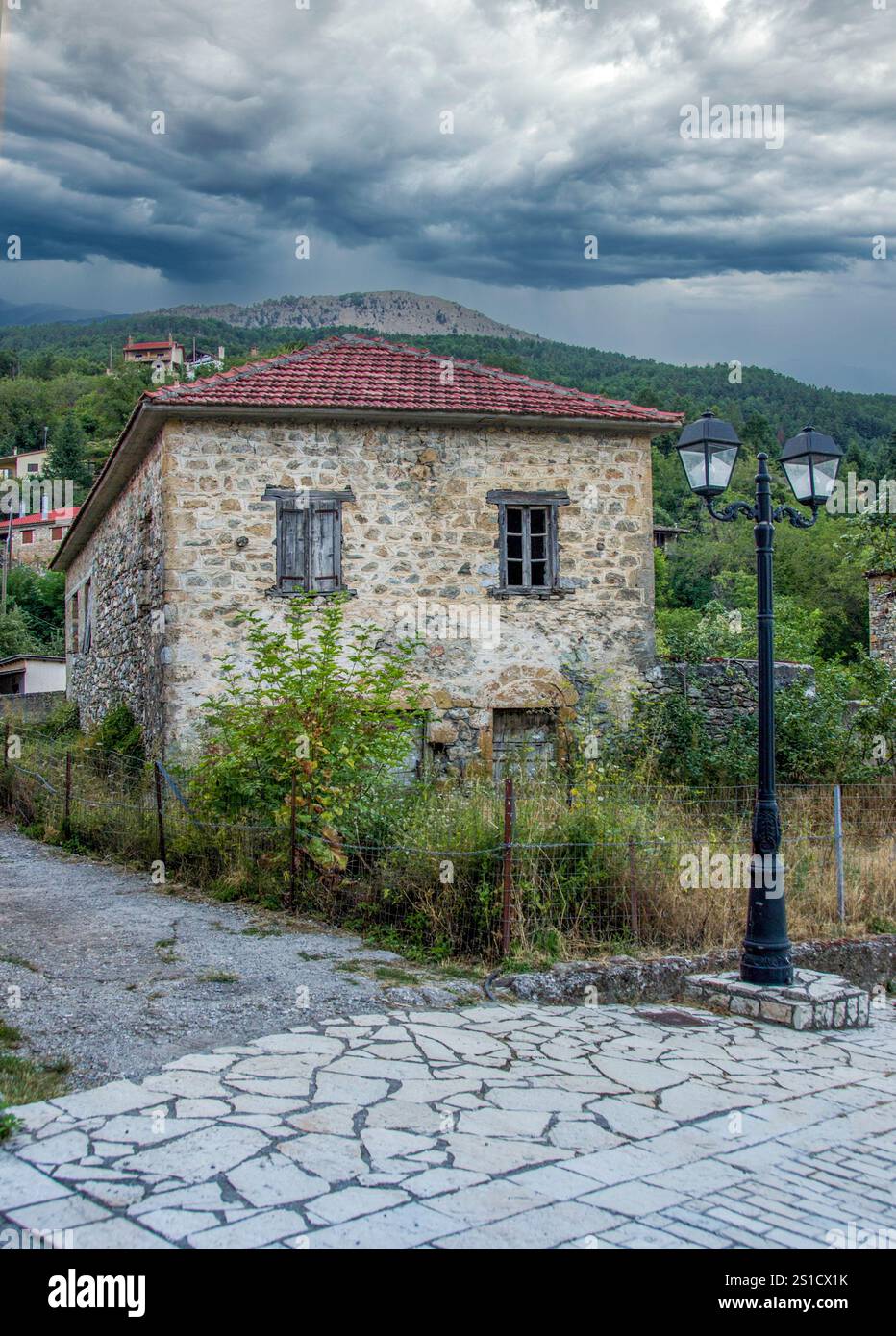 Street and houses in Zarouhla village in Greece. Aroania mountain ...