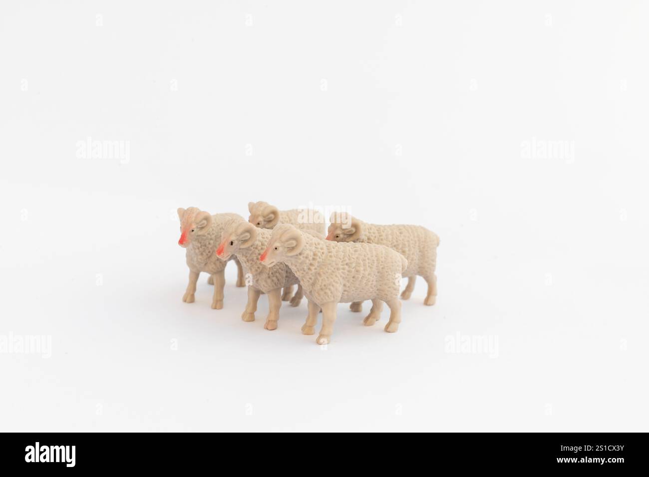 Miniature sheep figurines in grouping on white background Stock Photo ...