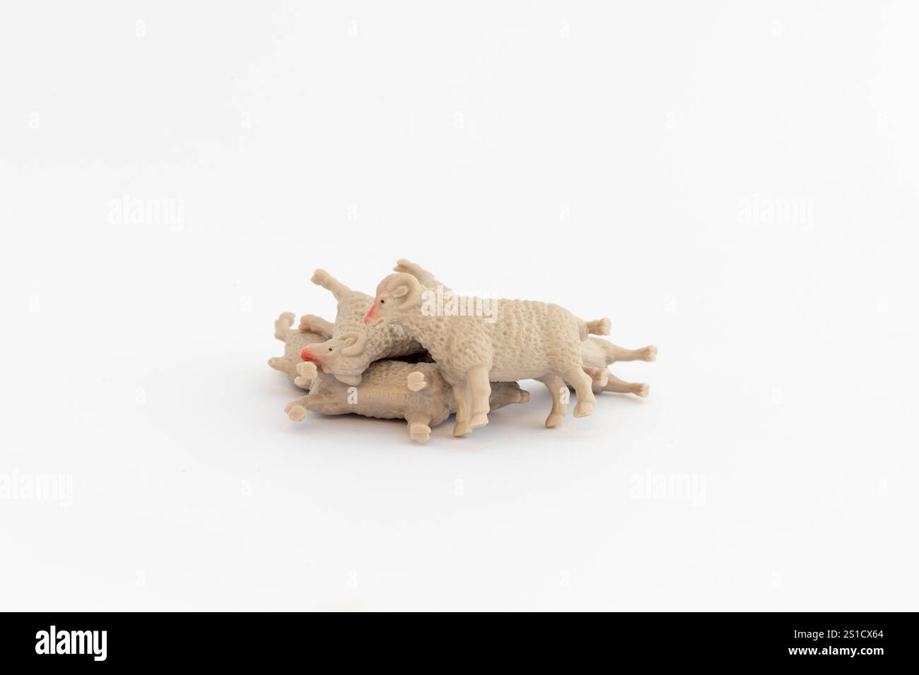Pile of miniature sheep figures on white isolated background Stock ...