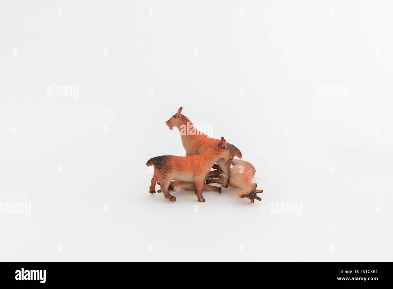 brown goat plastic animal toy on white background Stock Photo - Alamy