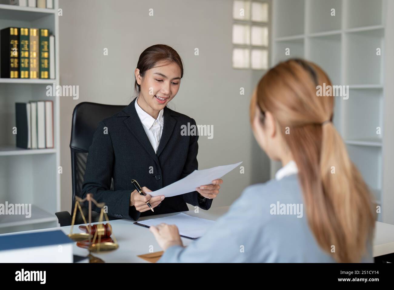 Lawyer client consultation office setting professional meeting modern ...