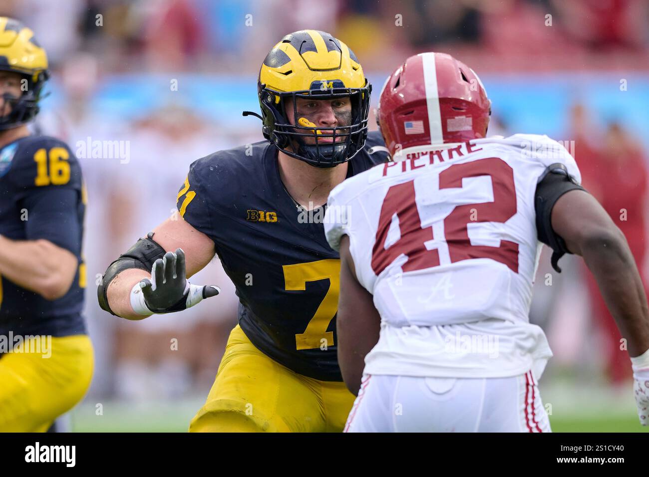 Tampa, Florida, USA. 31st Dec, 2024. Michigan offensive lineman Evan ...
