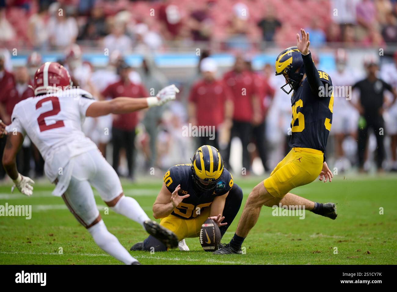 Tampa, Florida, USA. 31st Dec, 2024. Michigan place kicker Dominic ...