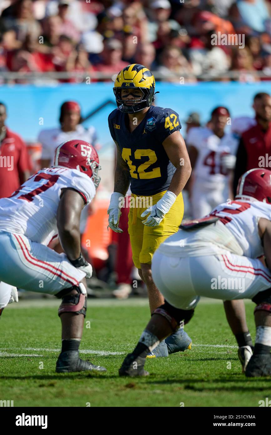Tampa, Florida, USA. 31st Dec, 2024. Michigan defensive end TJ Guy (42 ...