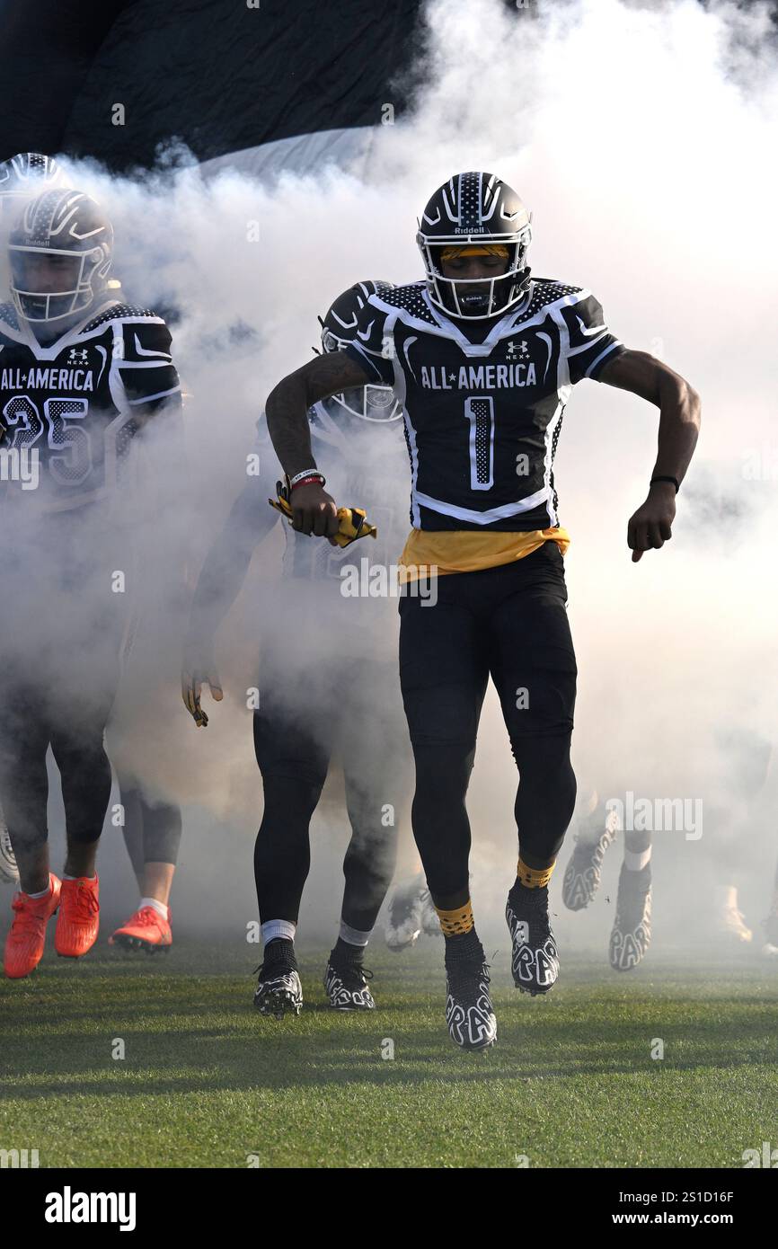 Team Icon receiver Dakorien Moore (1) leads teammates onto the field ...