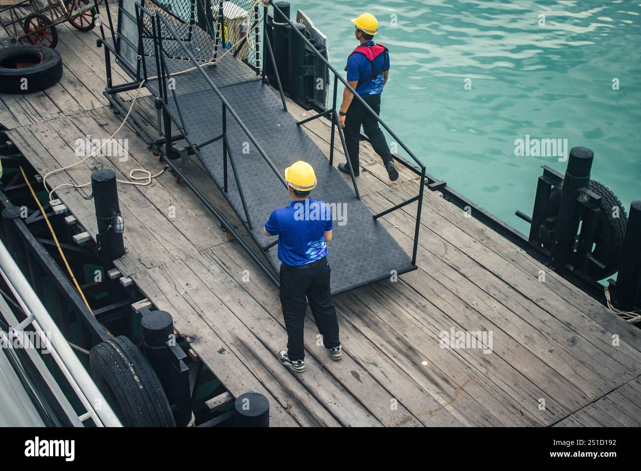 Koh Samui, Thailand, December 5, 2024 Employees of the Lomprayah ferry ...