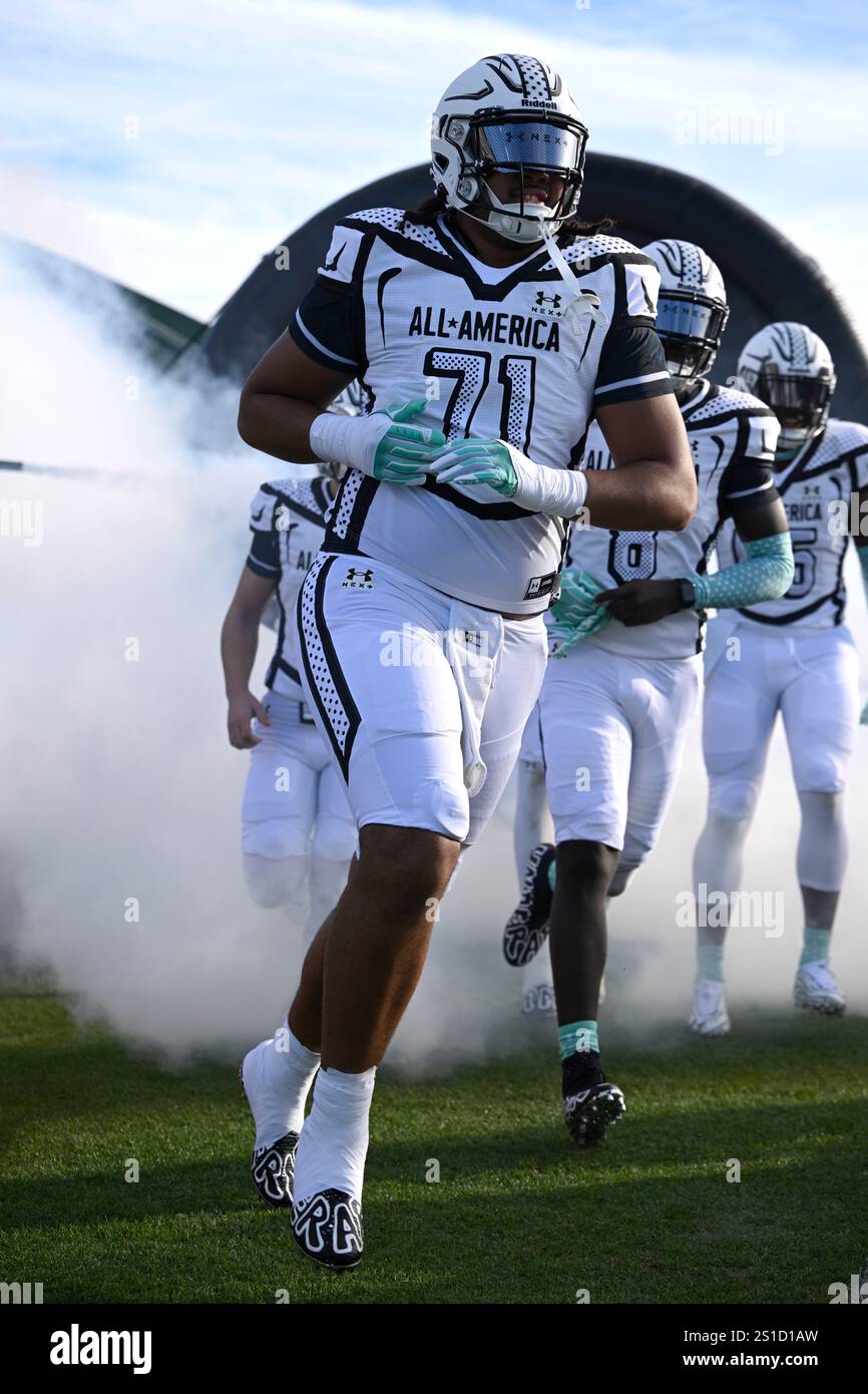Team Unstoppable offensive lineman Keenyi Pepe (71) runs onto the field ...
