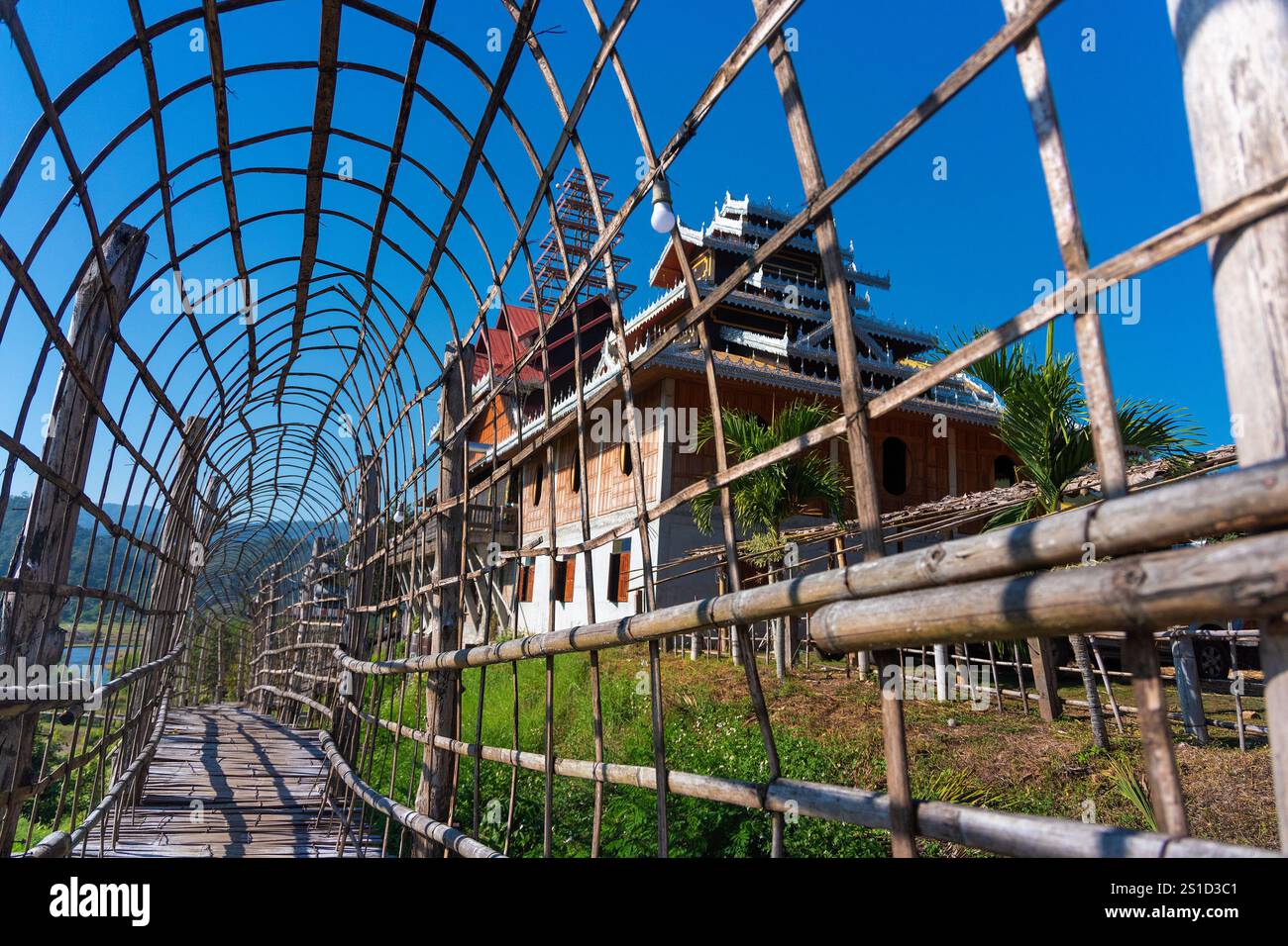 Bamboo Bridge and Buddhist temple in northern Thailand near Mae Hong ...