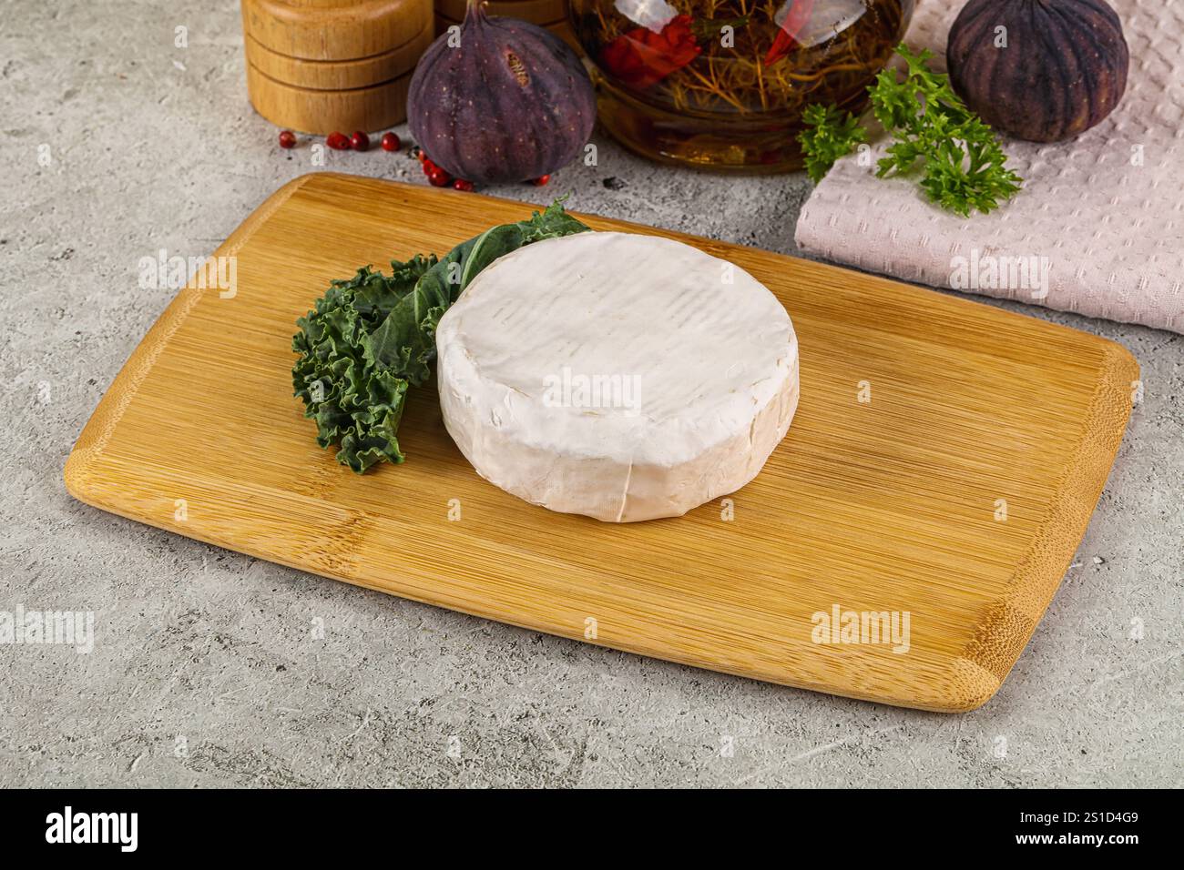 Gourmet round creamy Camembert cheese served fig Stock Photo - Alamy