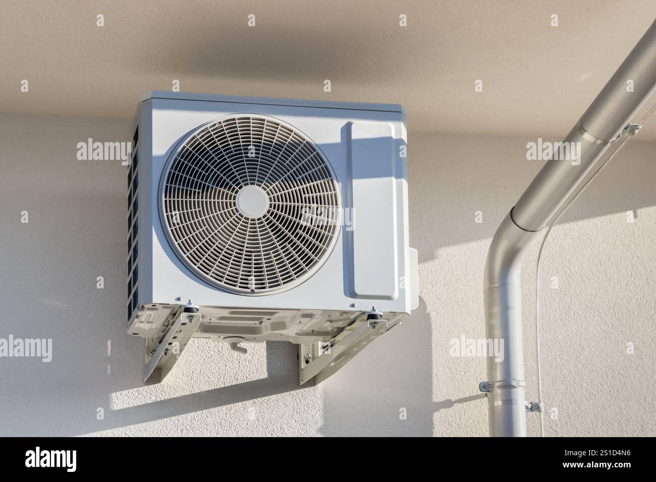 Air source heat pumps installed under a roof modern family house under ...