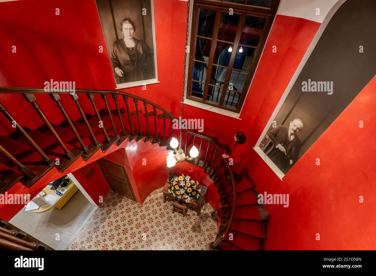 A visitor ascends a staircase inside Bialik House built in 1925, which ...