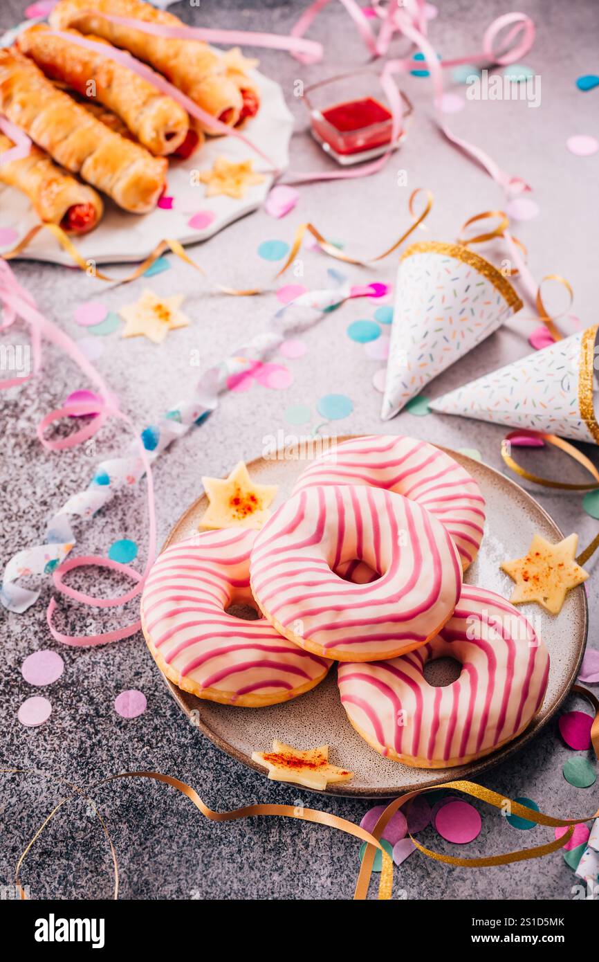 Long sausages wrapped in yeast dough with donuts - traditional carnival ...