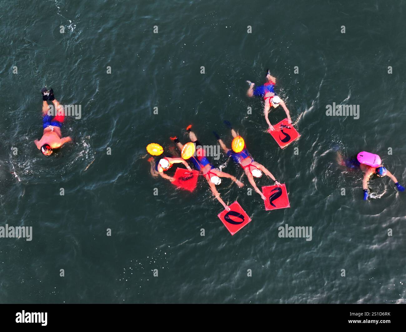 People swim in the cold water to welcome the new year in Lianyungang ...