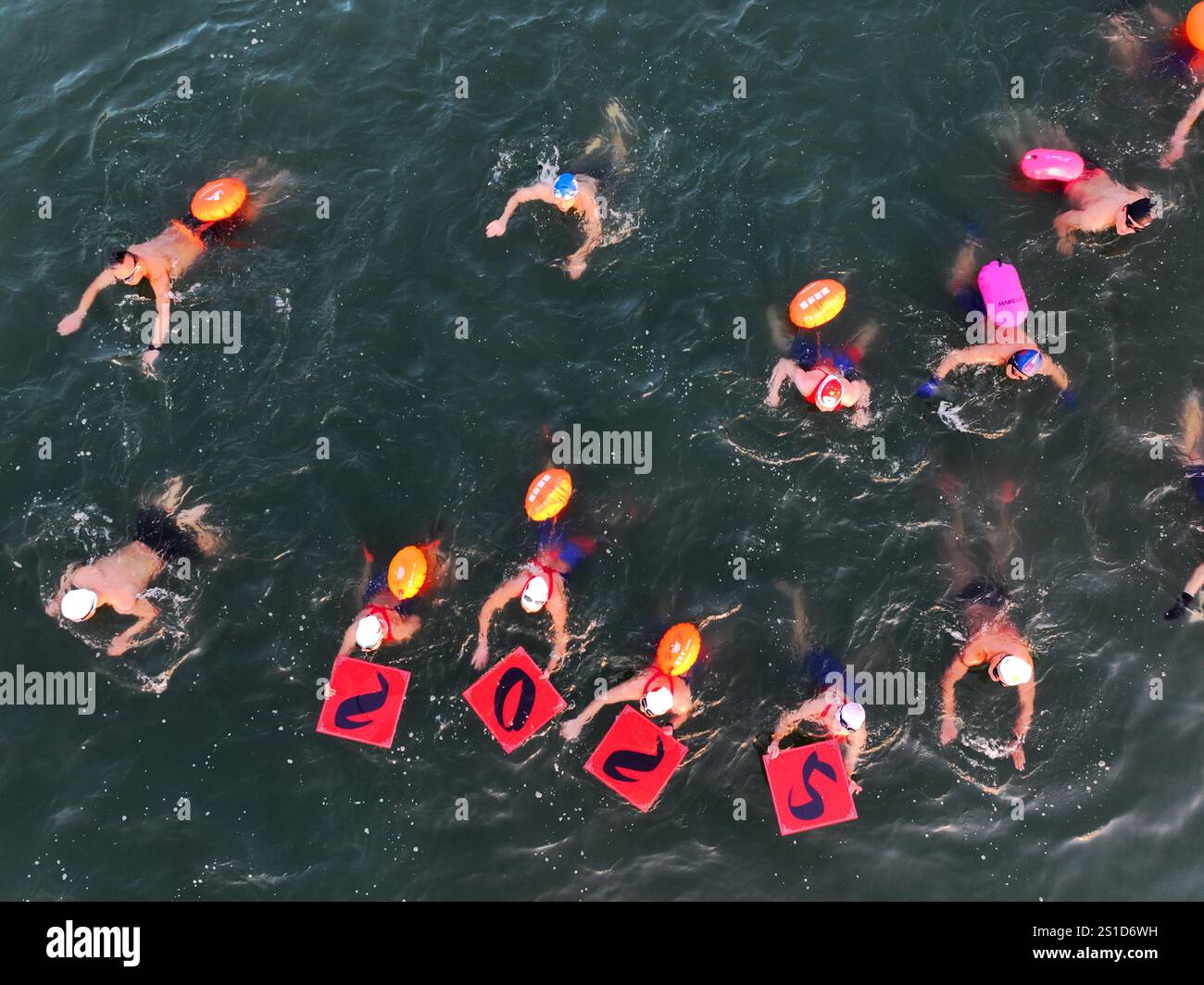 People swim in the cold water to welcome the new year in Lianyungang ...