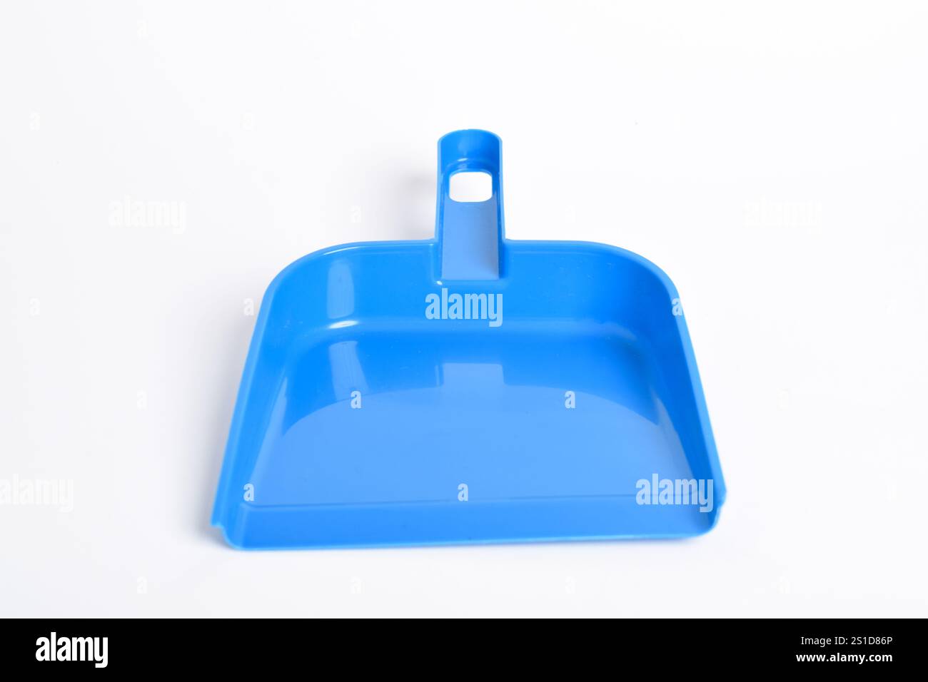 Small blue dustpan isolated on white background Stock Photo - Alamy