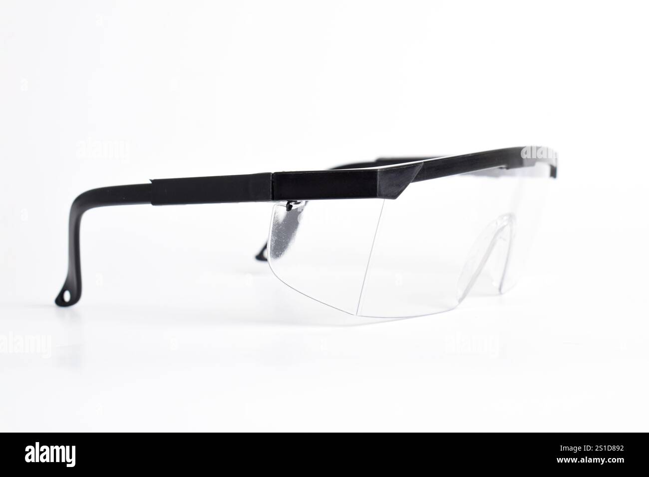 Clear plastic safety goggles isolated on white background Stock Photo ...