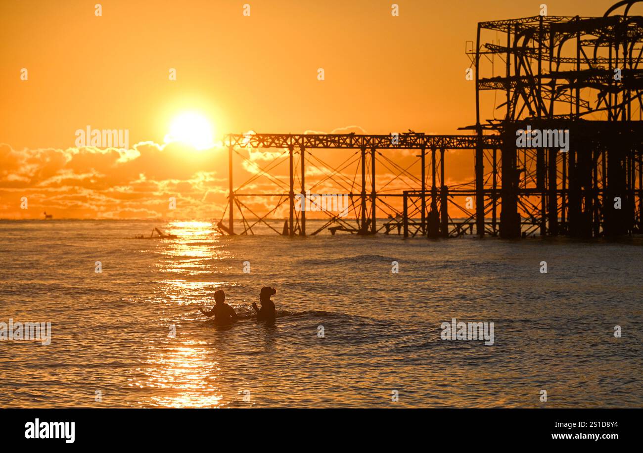 Brighton UK 3rd January 2025 - Sea swimmers brave the freezing cold ...