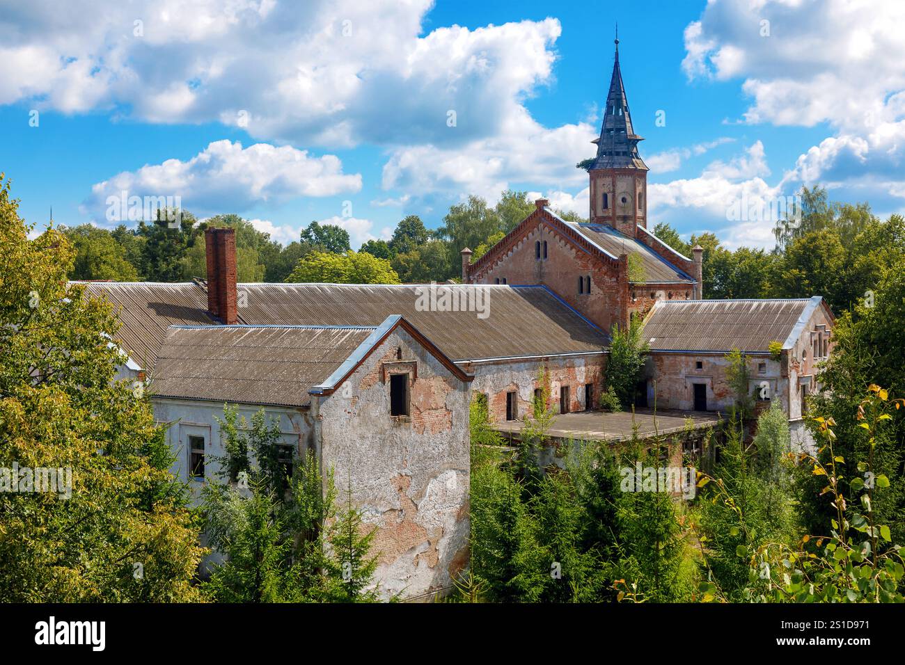 View of the old abandoned Catholic Church overgrown with greenery and ...