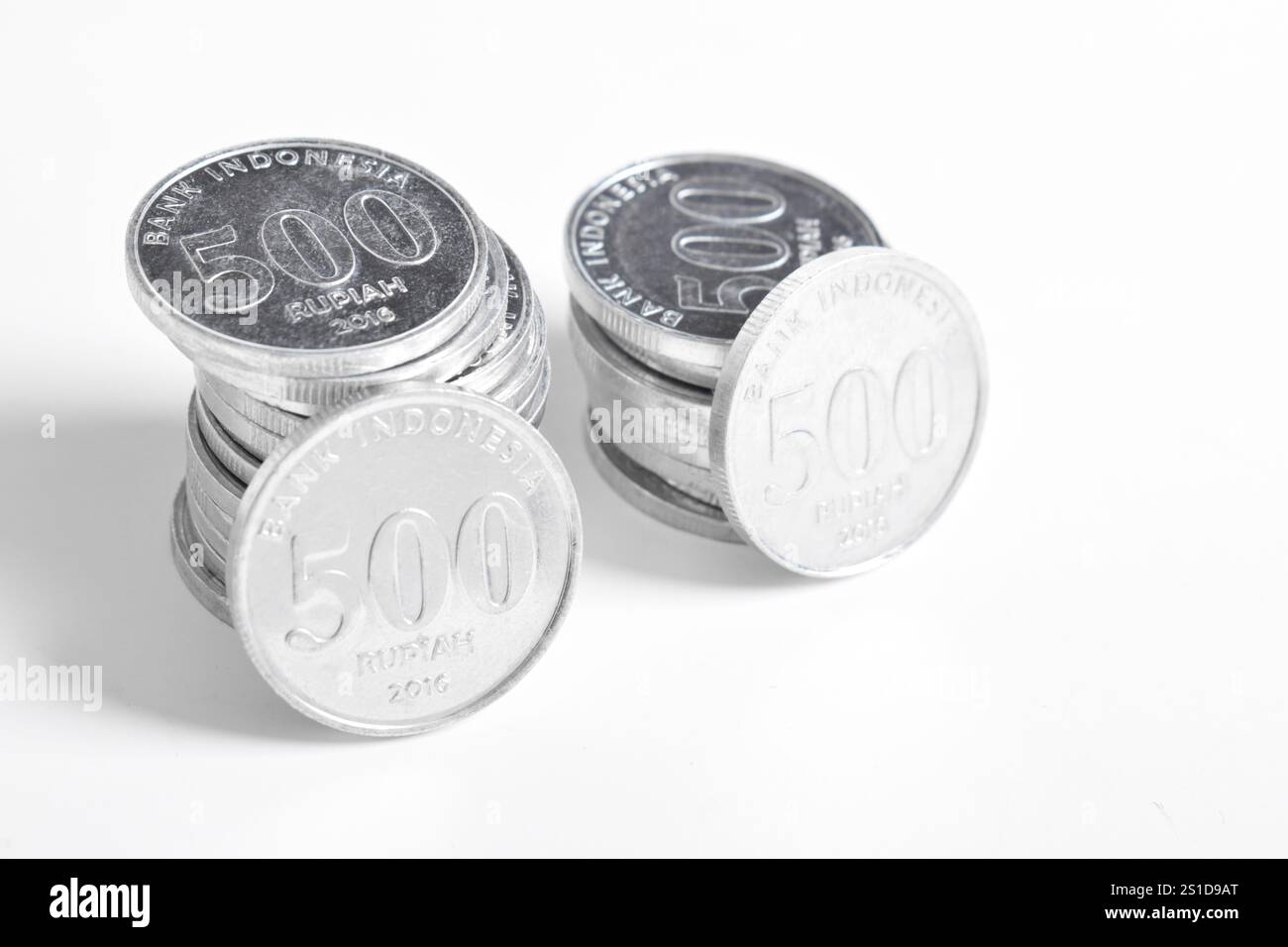 Stack of 500 rupiah coins on white background. National currency ...