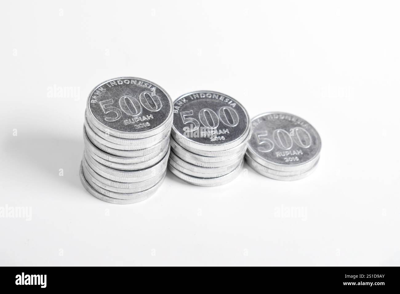 Stack of Indonesian coins on white background. National currency. 500 ...