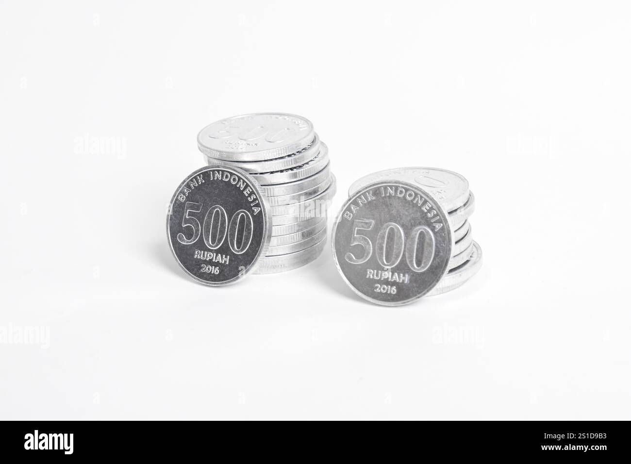 Stack of 500 rupiah coins on white background. National currency ...