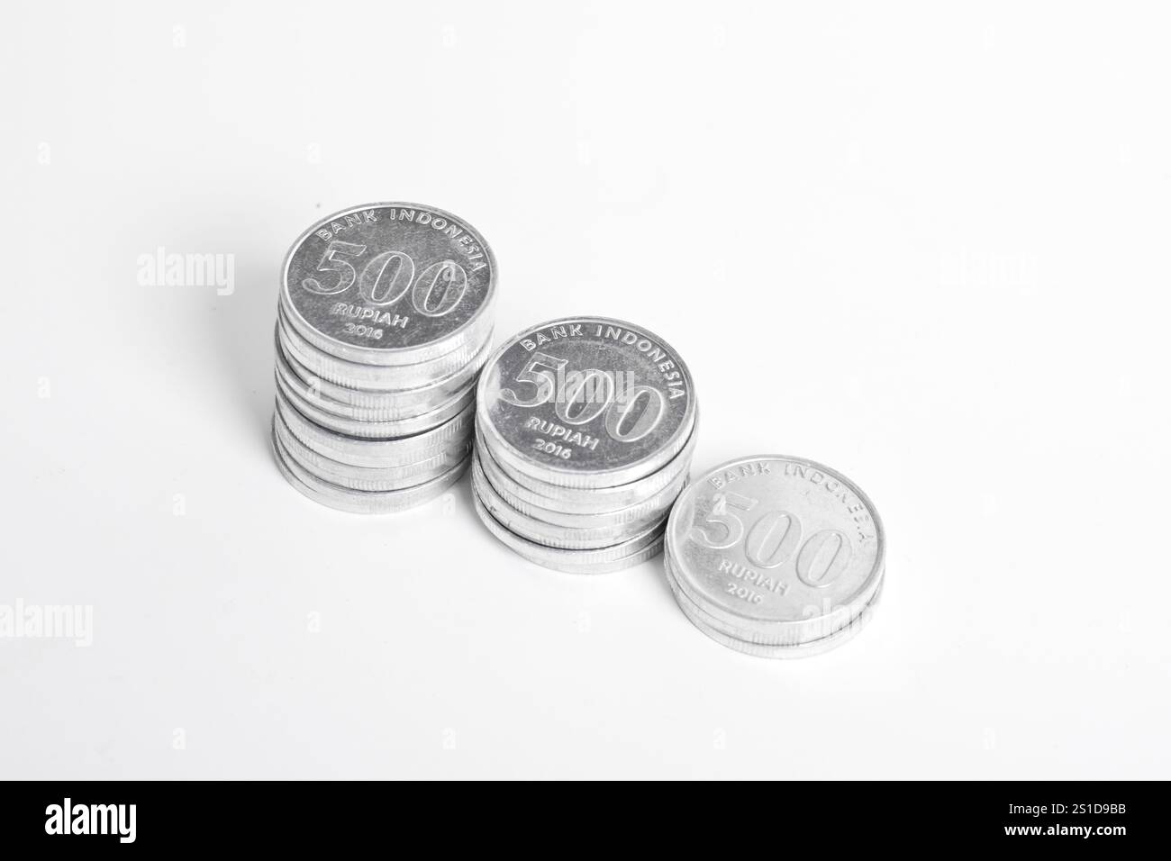 Stack of Indonesian coins on white background. National currency. 500 ...