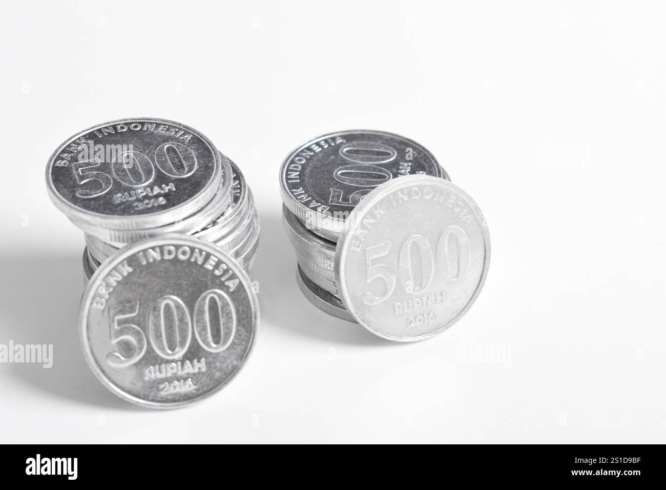 Stack of 500 rupiah coins on white background. National currency ...