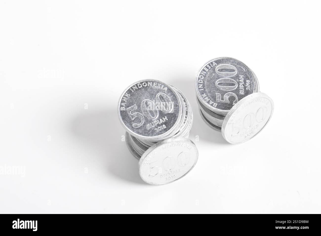 Stack of 500 rupiah coins on white background. National currency ...