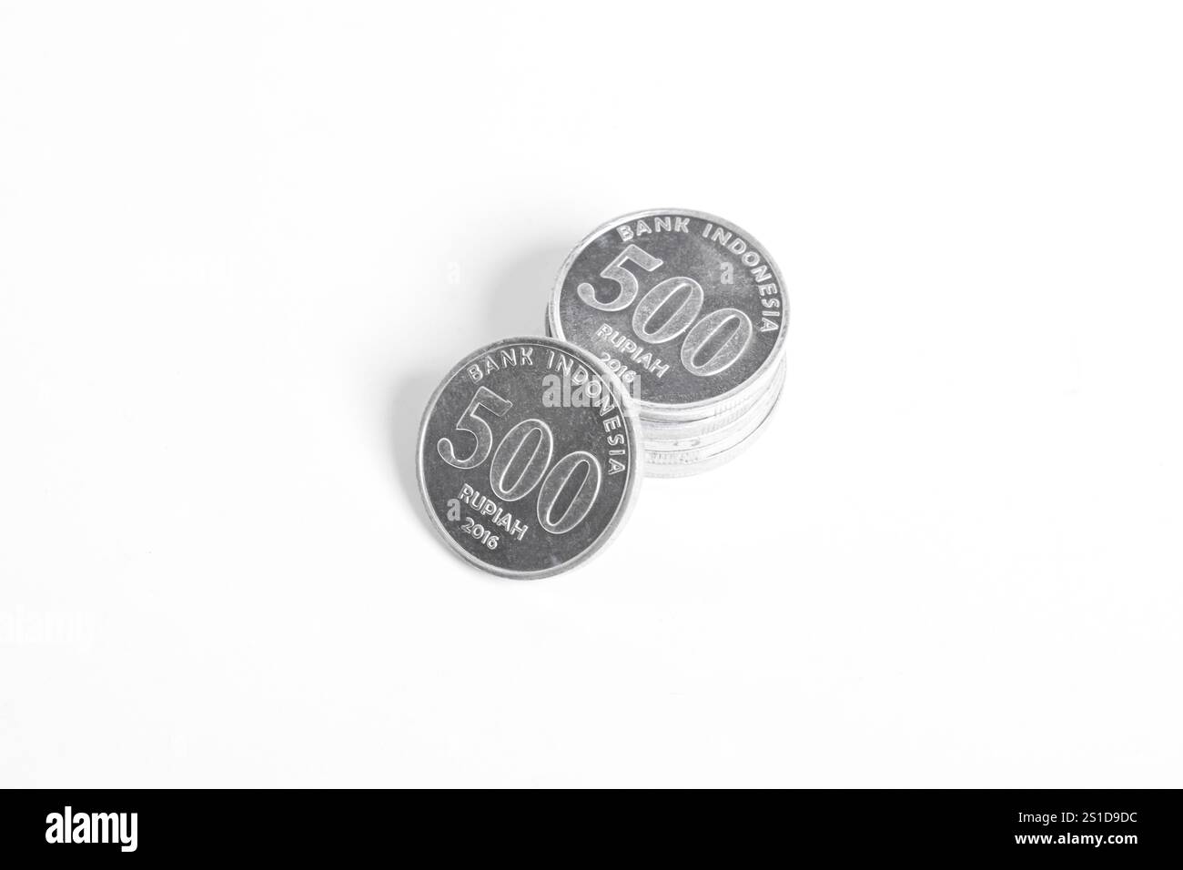Silver coins stacks isolated on a white background. Indonesian rupiah ...
