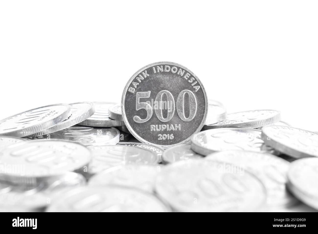 Indonesian five hundred rupiah coin standing with other coins isolated ...