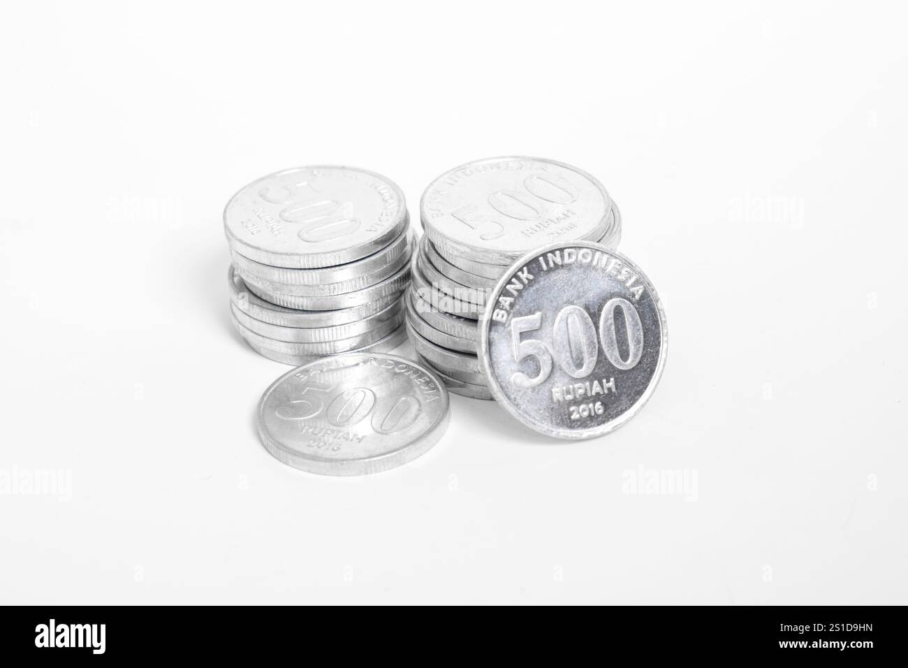 Silver coins stacks isolated on a white background. Indonesian rupiah ...