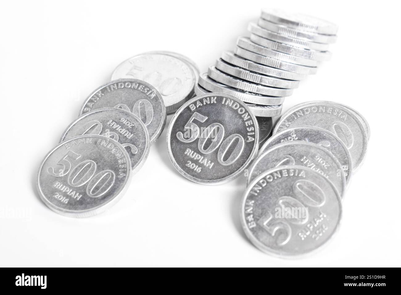 Silver coins stacks isolated on a white background. Indonesian rupiah ...