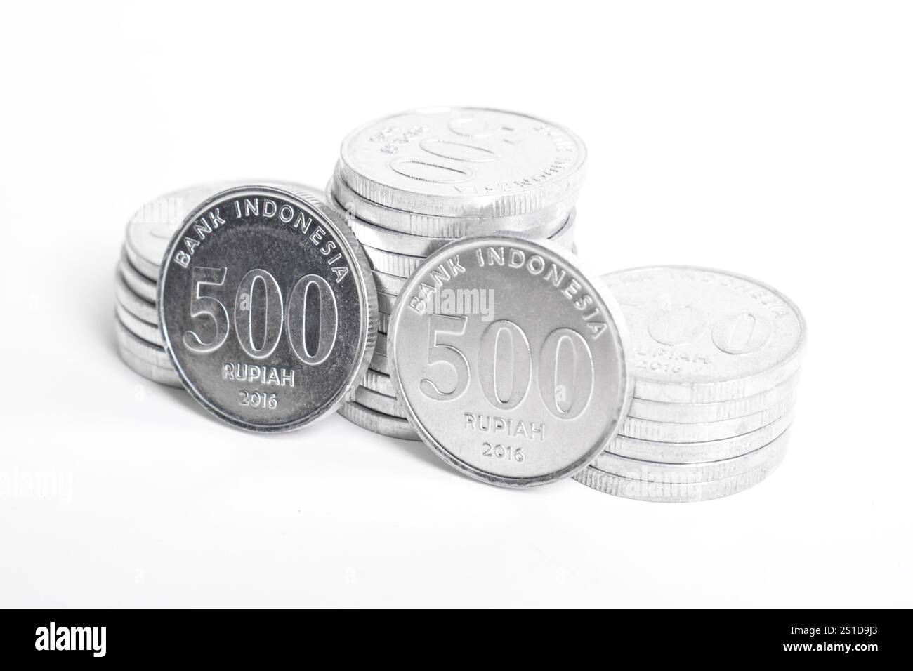 Silver coins stacks isolated on a white background. Indonesian rupiah ...