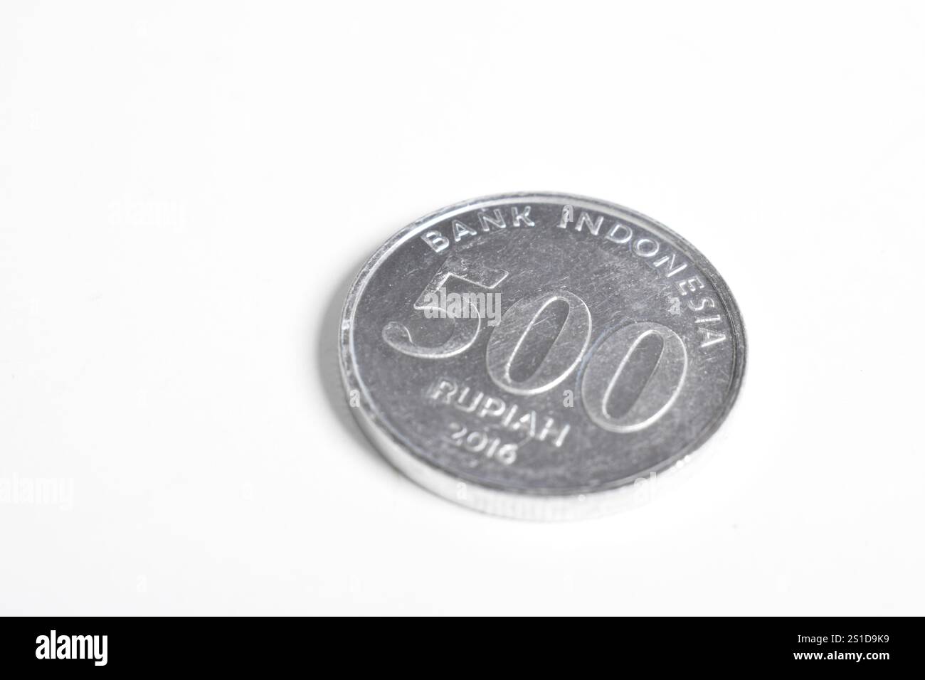 Silver coins stacks isolated on a white background. Indonesian rupiah ...