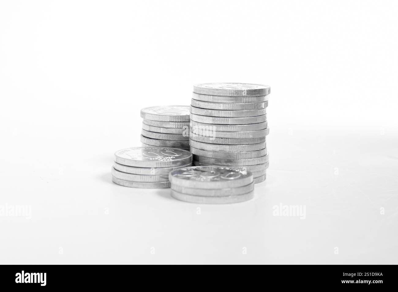 Coins stacks isolated on a white background. Silver coin money. Piles ...