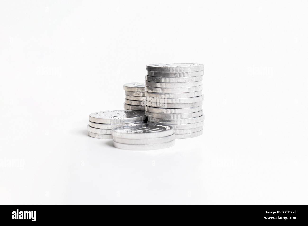 Coins stacks isolated on a white background. Silver coin money. Piles ...
