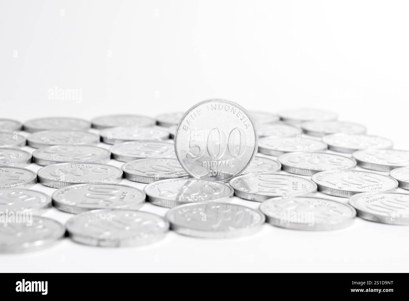 Indonesian five hundred rupiah coin standing with other coins isolated ...