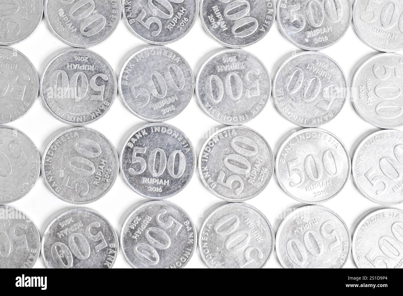 Stack of 500 rupiah coins on white background. National currency ...