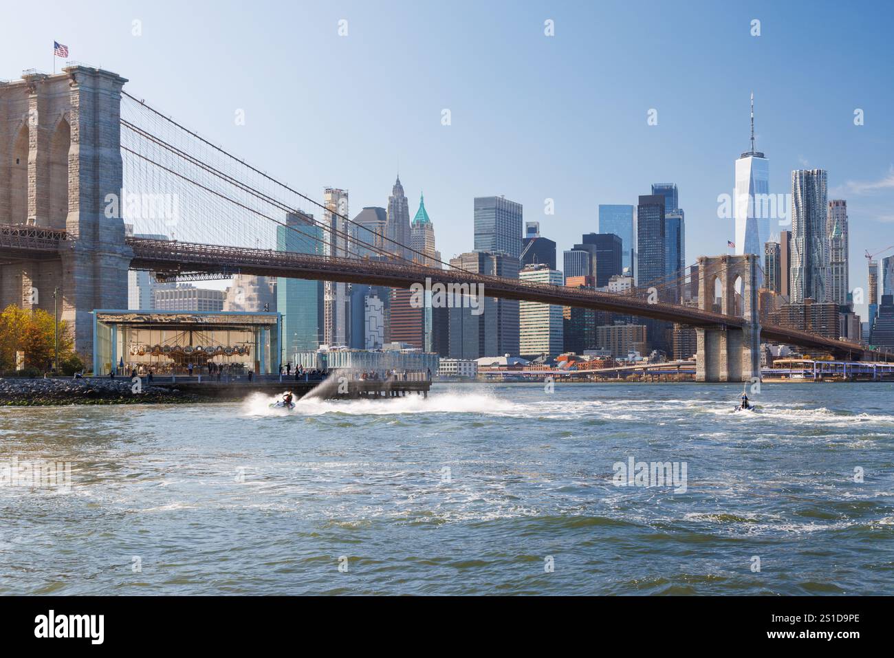 Iconic view of Brooklyn Bridge with Manhattan skyscrapers in the ...