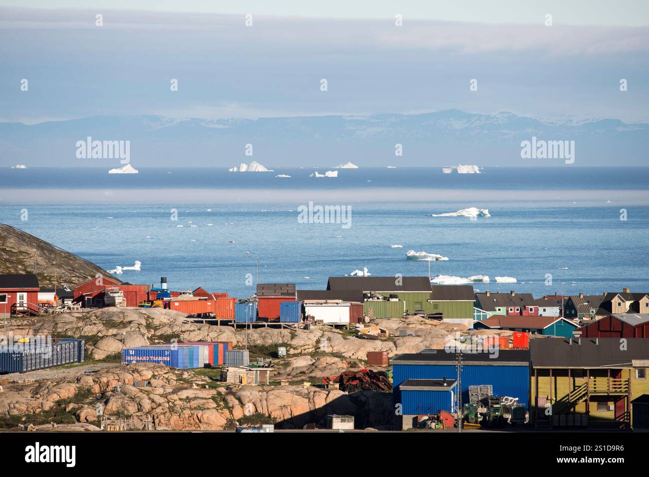 A striking view of Ilulissat, Greenland, featuring majestic icebergs ...