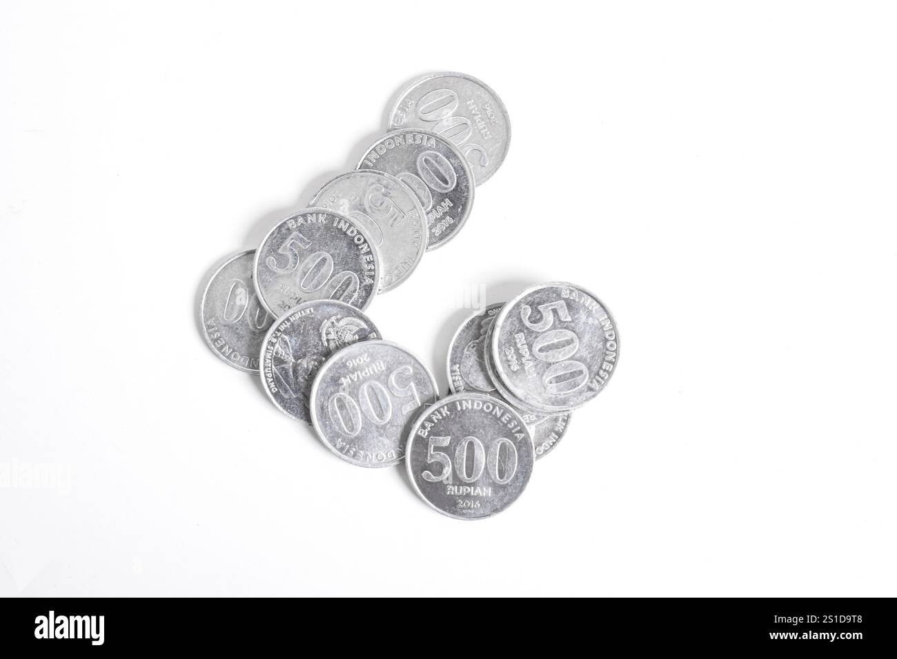 Silver coins stacks isolated on a white background. Indonesian rupiah ...
