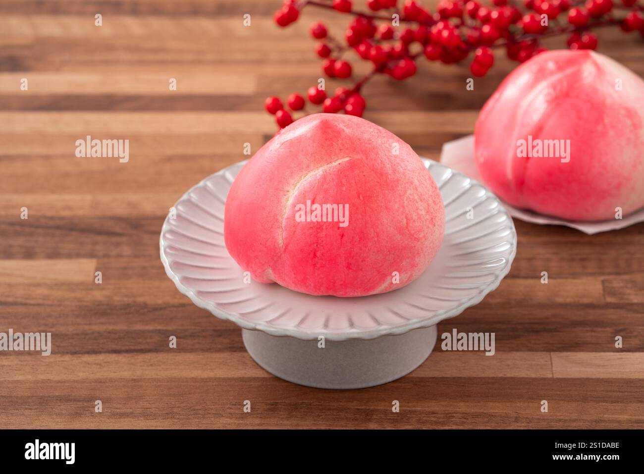 Pink Chinese peach birthday bun food longevity peach shoutao on wooden ...