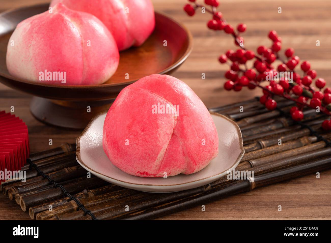 Pink Chinese peach birthday bun food longevity peach shoutao on wooden ...