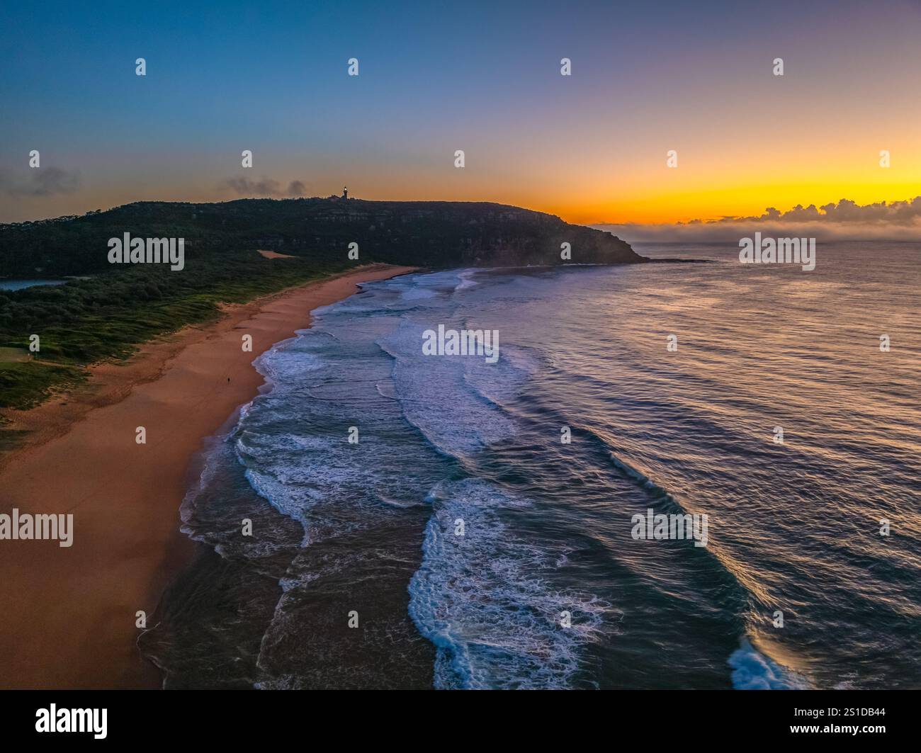 Aerial sunrise views with low cloud bank and fog rolling over the water ...