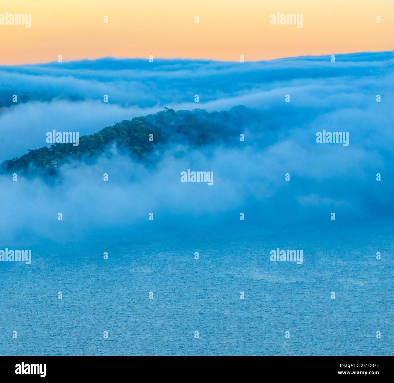 Aerial sunrise views with low cloud bank and fog rolling over the ...