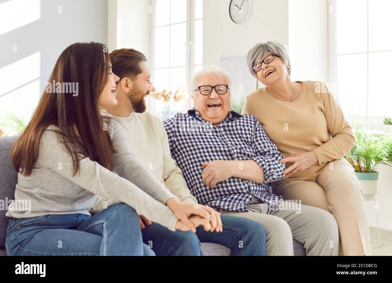 Happy laughing family fun of multi generational relative people at home ...